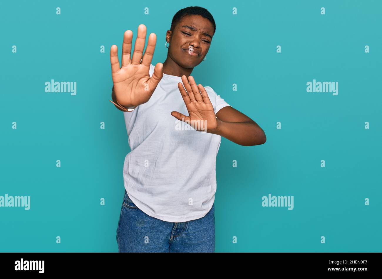 Young african american woman wearing casual white t shirt doing stop ...