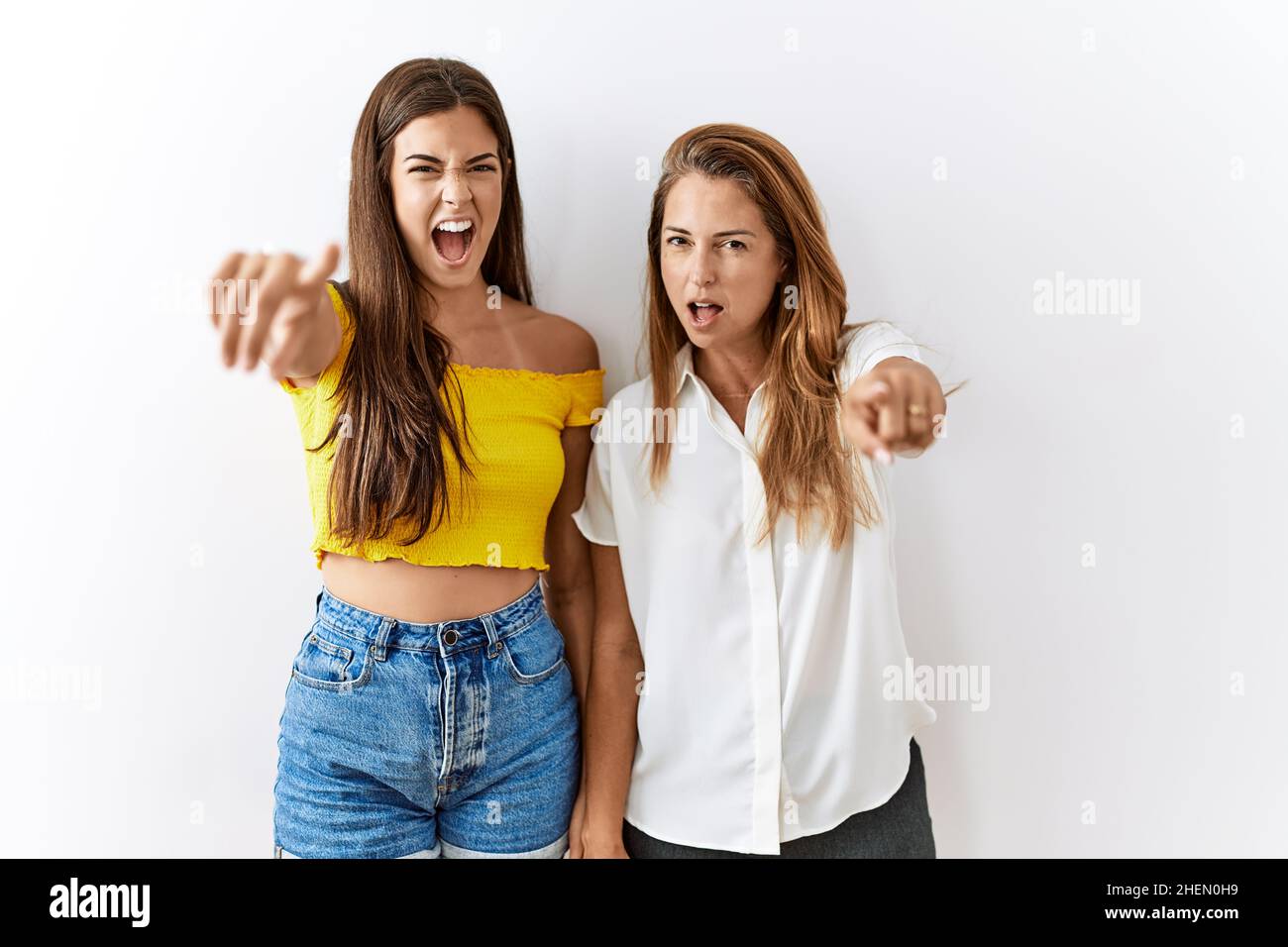 Mother And Daughter Together Standing Together Over Isolated Background
