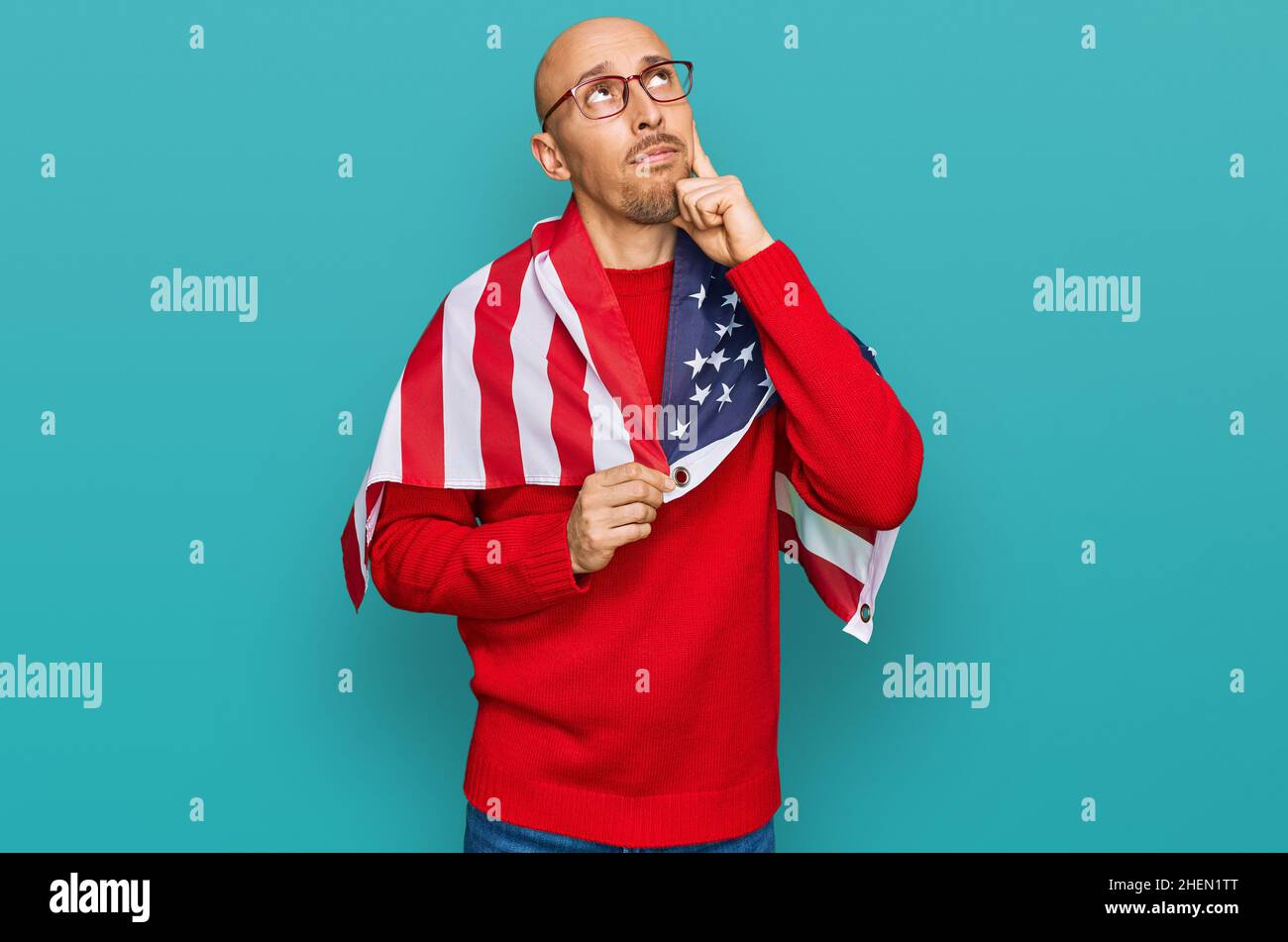 Bald man with beard wrapped around united states flag serious face ...