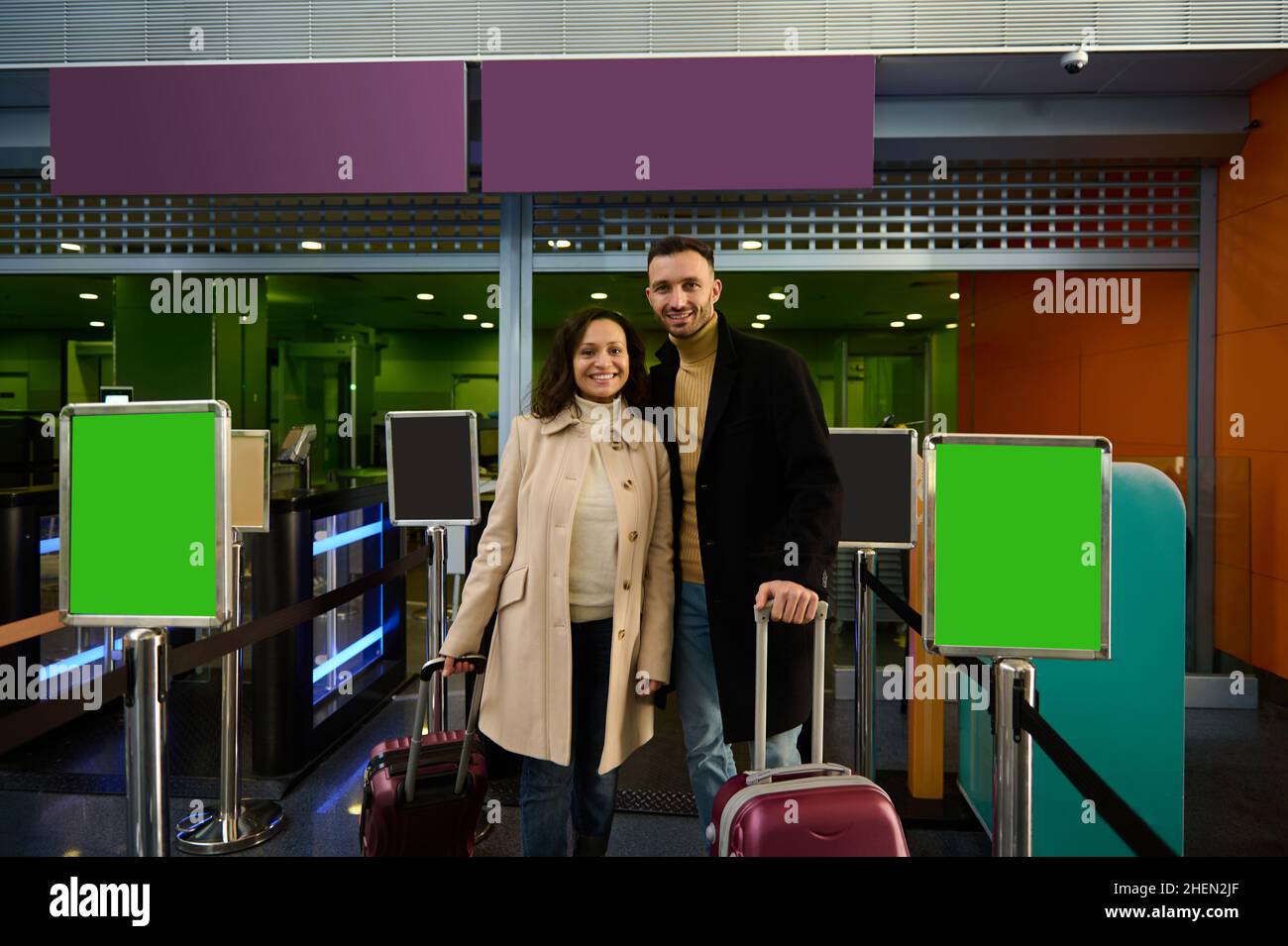 Happy young couple, man and woman, business partners standing with ...