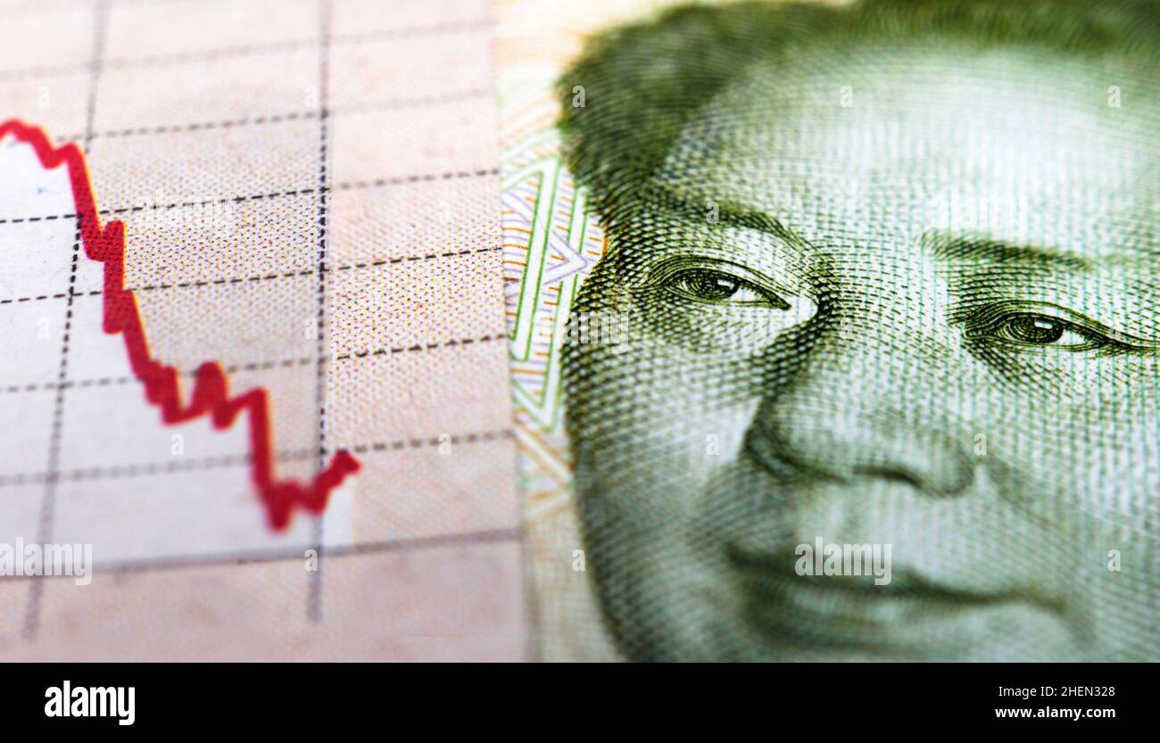 Stock Market Graph next to a Chinese Yuan banknote. Red trend line ...