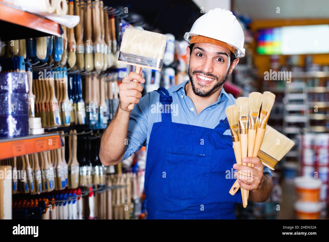 Handyman in blue uniform works hi-res stock photography and images - Alamy