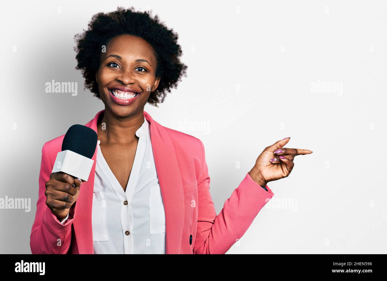 African american woman with afro hair holding reporter microphone ...