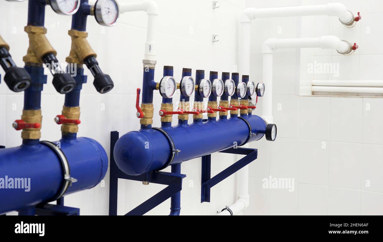 Close up of manometer, pipes and faucet valves of heating system in a ...