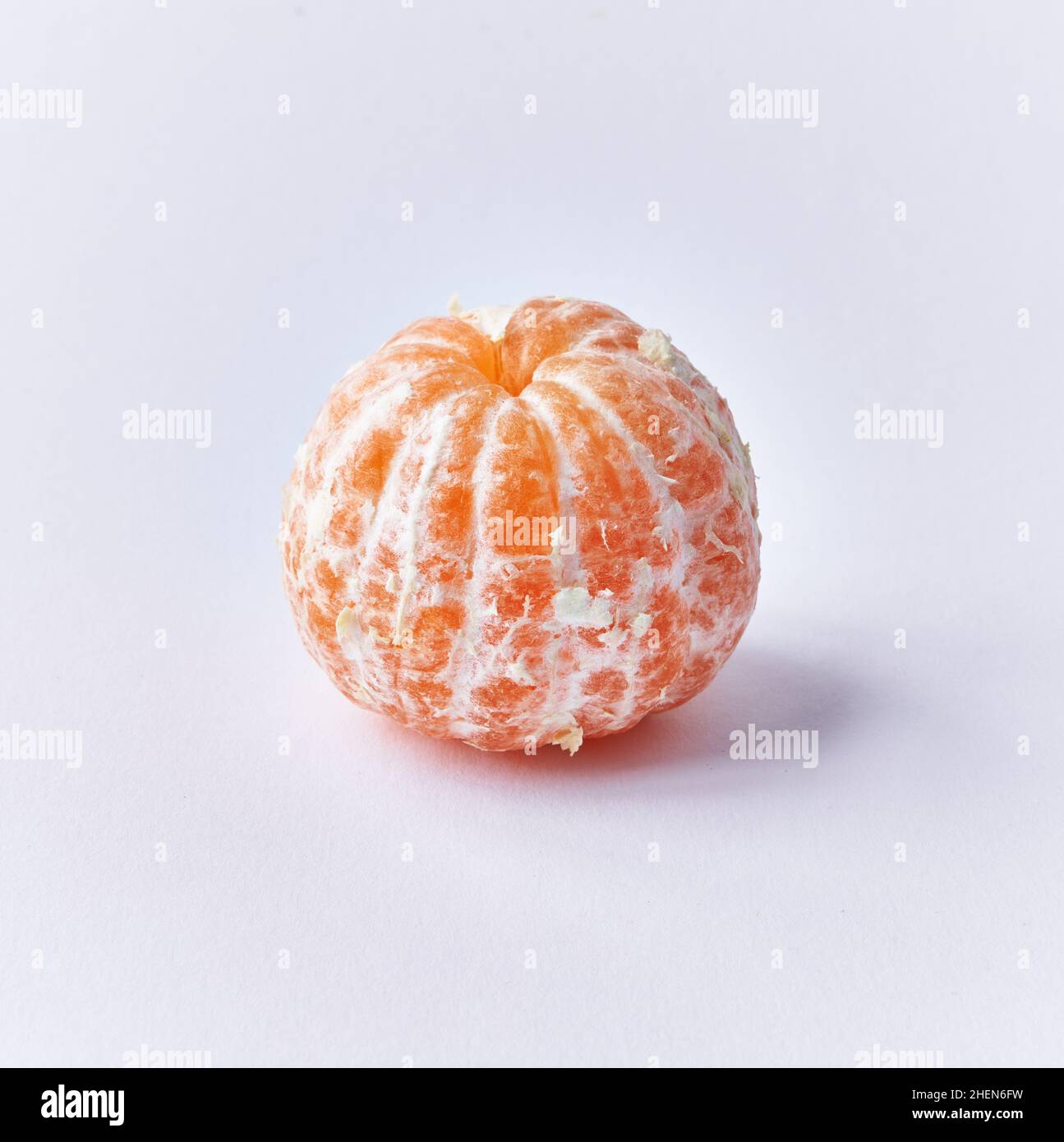 Single peeled tangerine isolated over white background Stock Photo - Alamy