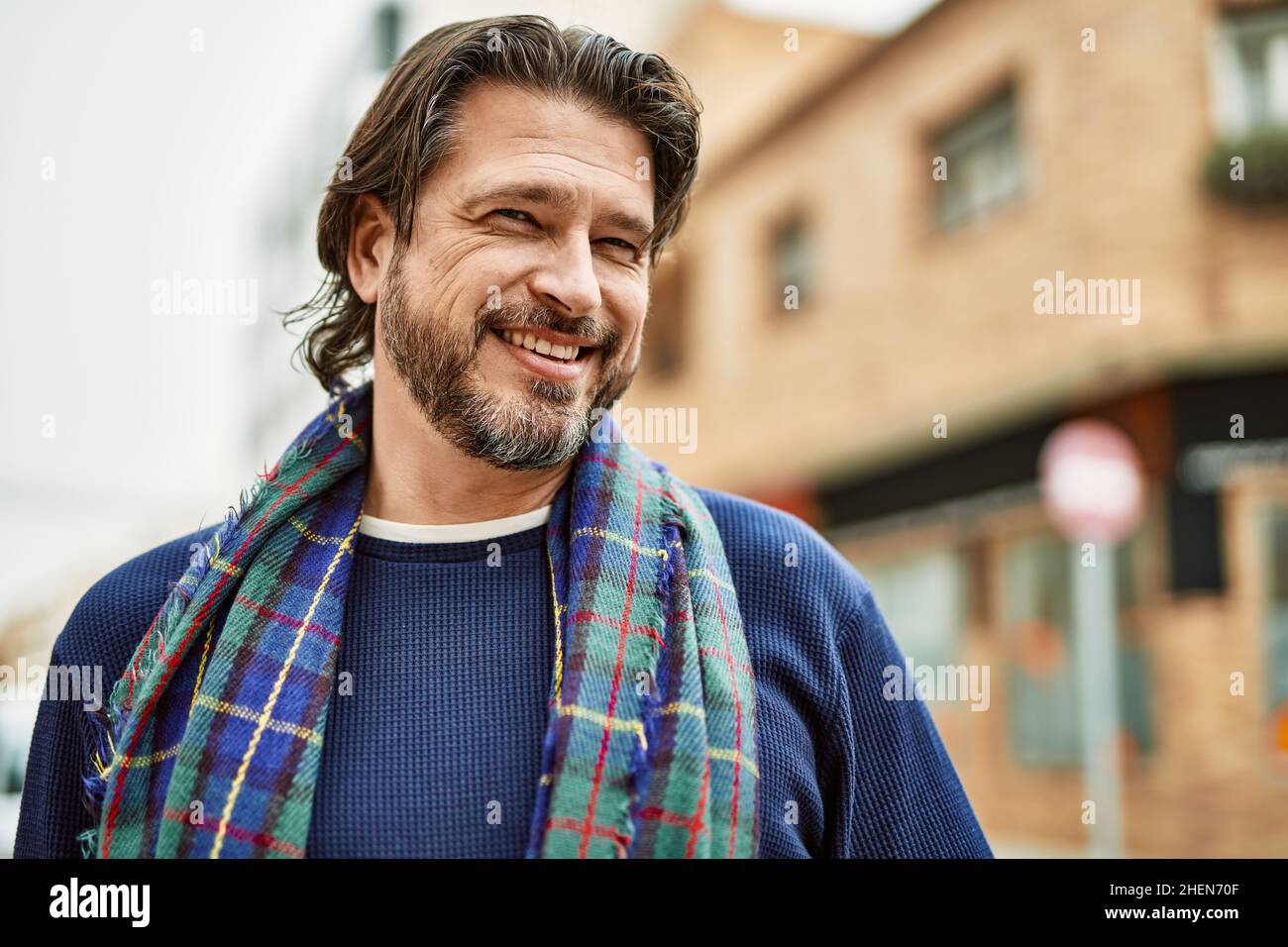 Middle age handsome man smiling at the town Stock Photo - Alamy