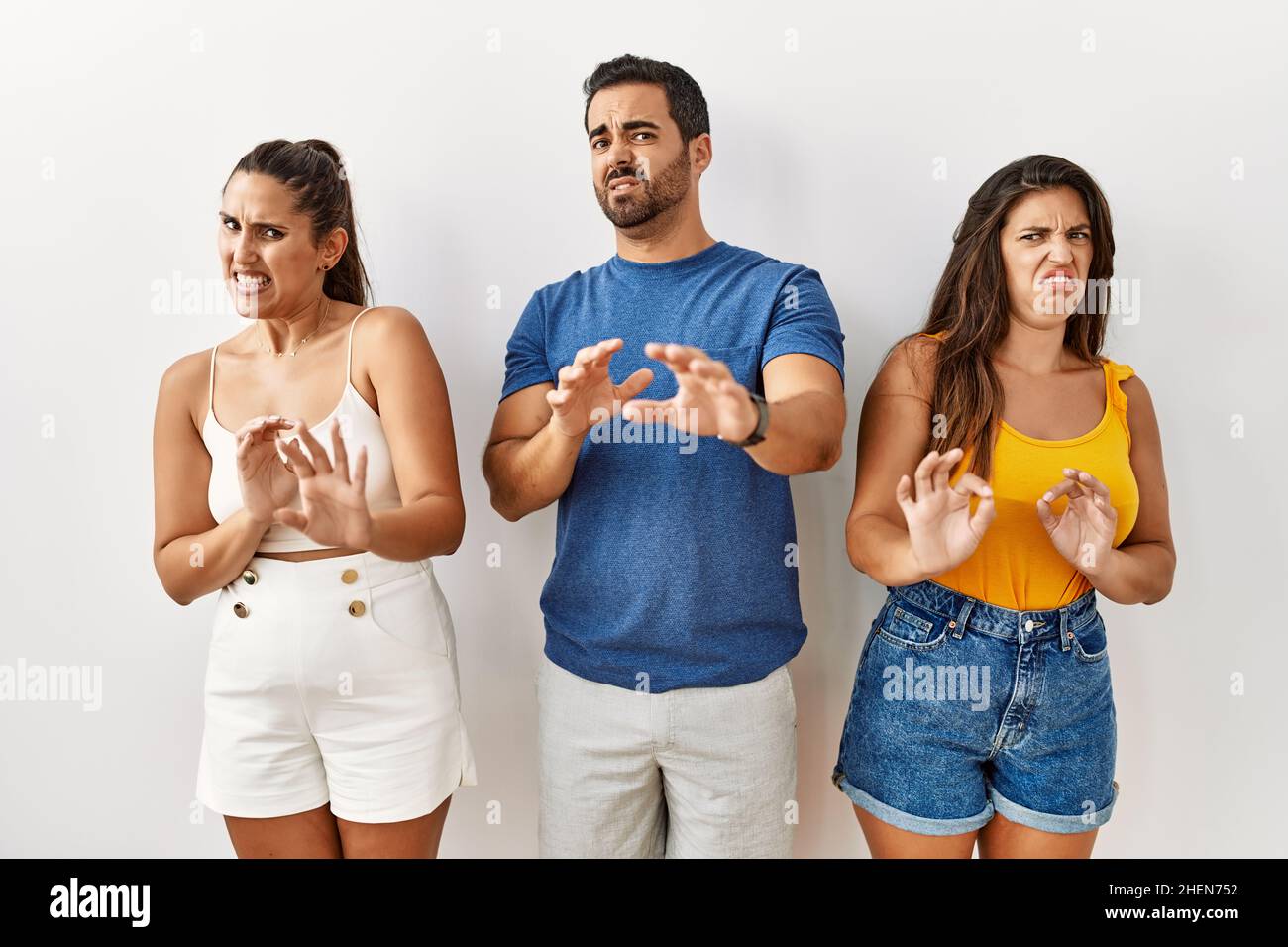 Group of young hispanic people standing over isolated background ...