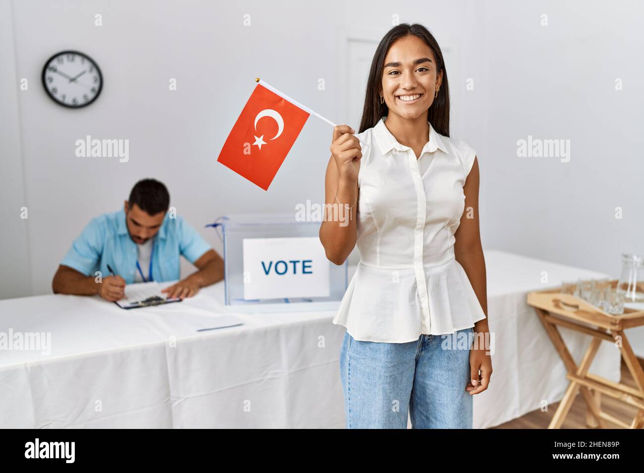 Young turkish voter woman smiling happy holding turkey flag at ...