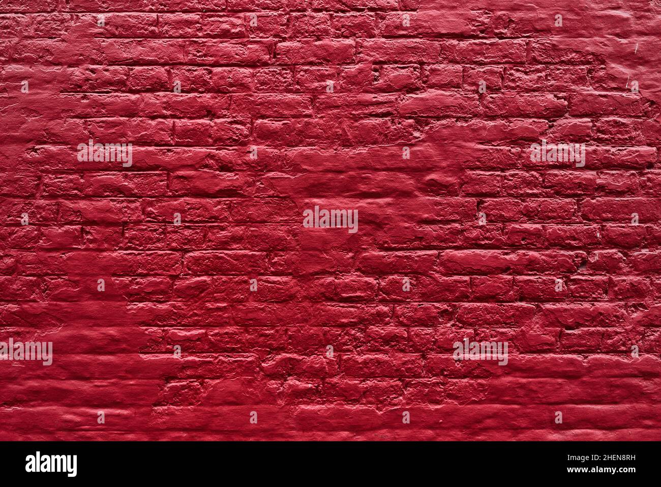 Painted red brick wall surface background Stock Photo - Alamy