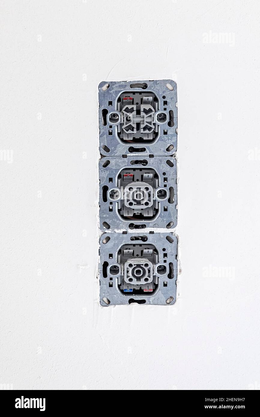 electric sockets at a plaster wall at the construction site Stock Photo ...