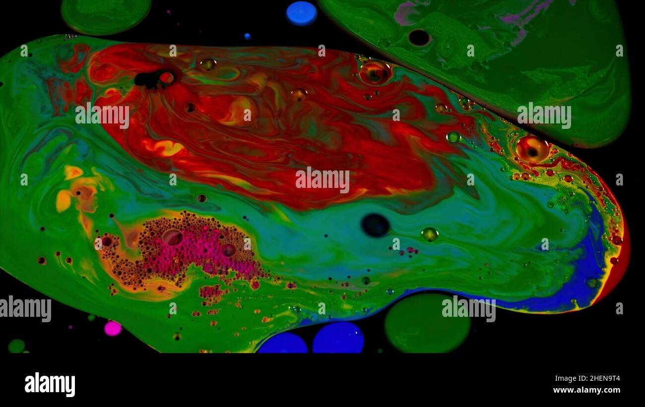 Abstract colorful paint reactions, psychedelic liquid light show, dye ...