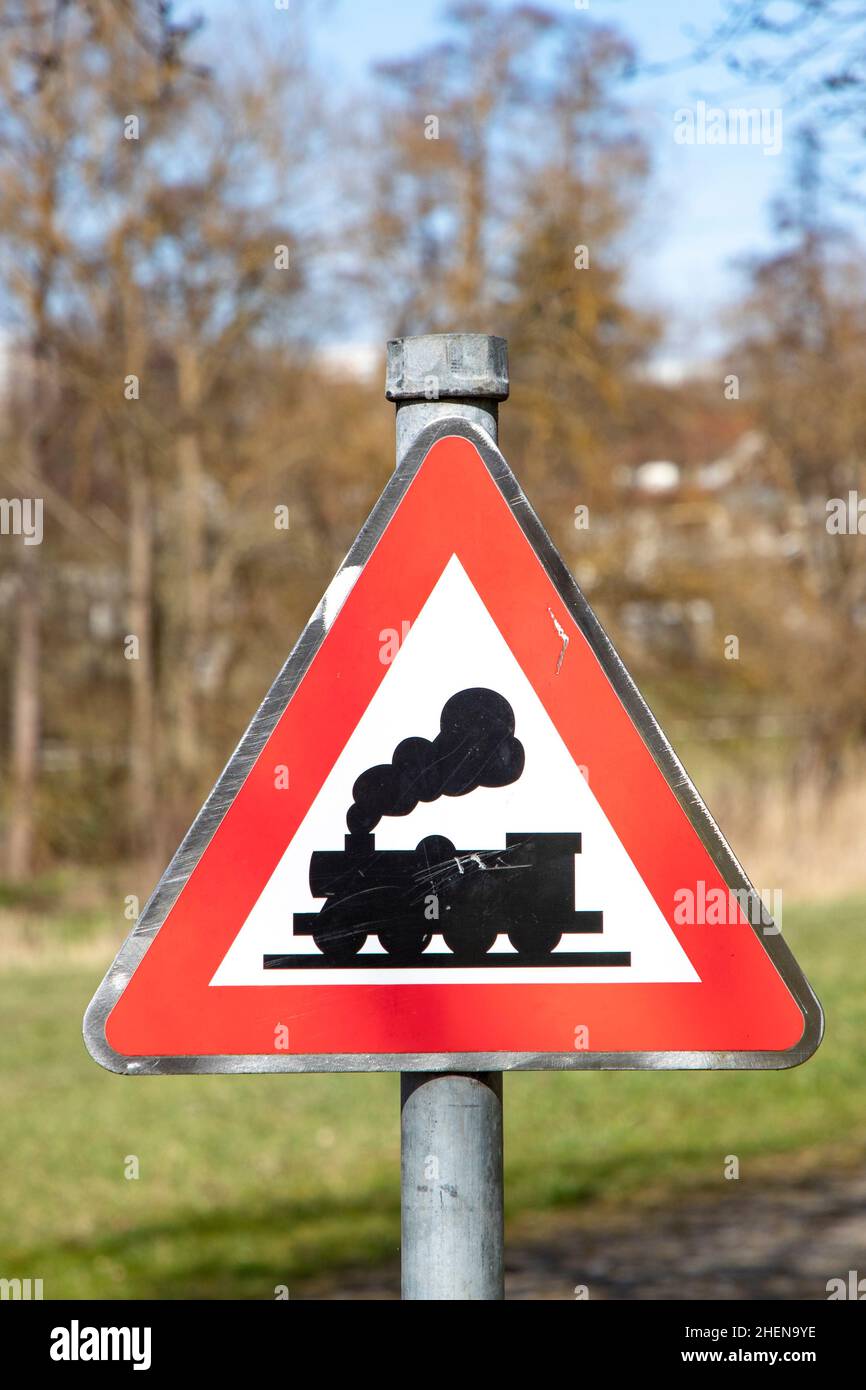 Railroad Level Crossing Sign without barrier or gate ahead the road ...