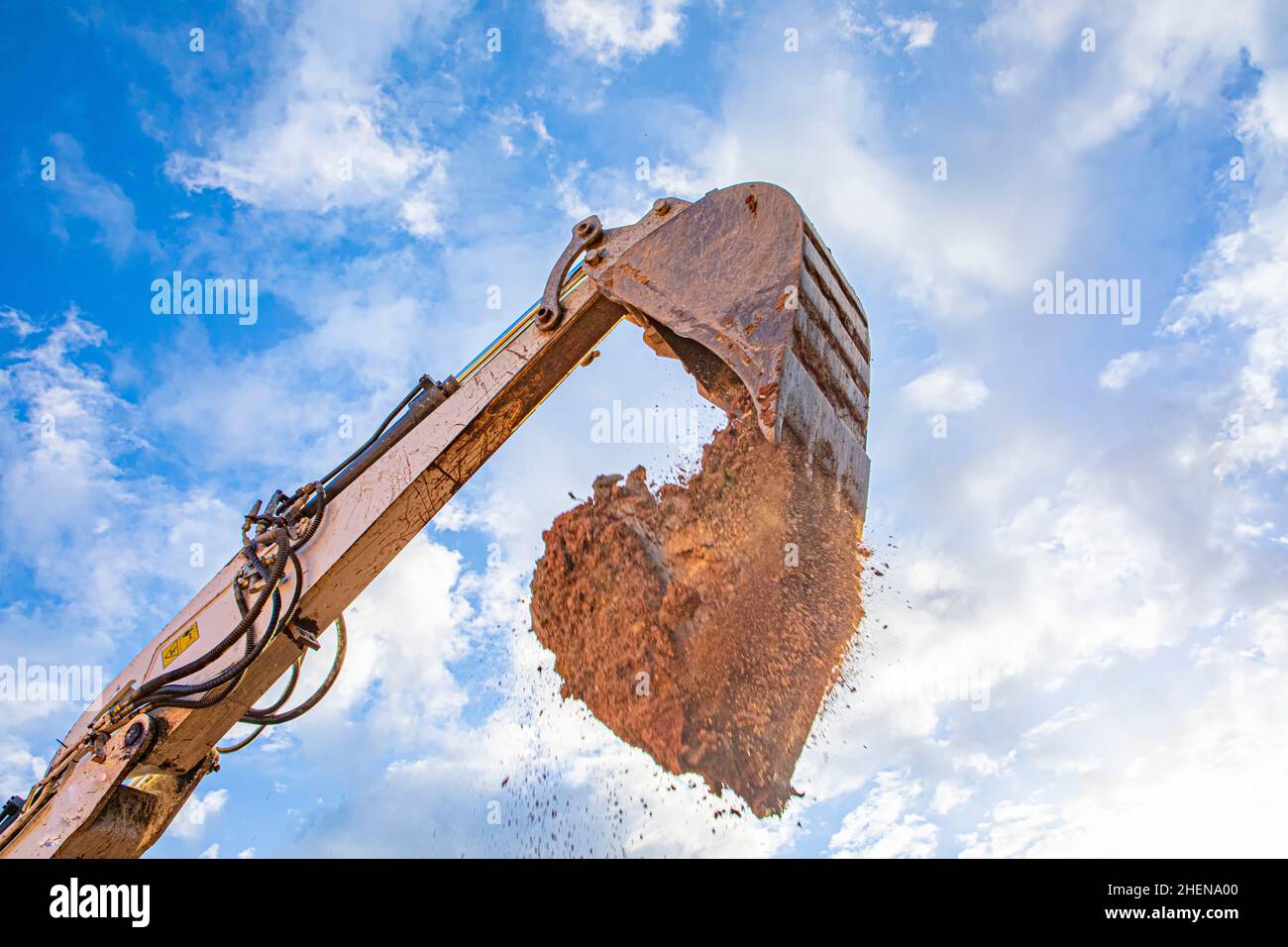 detail of excavator bucket filled with soil under blue sky Stock Photo ...
