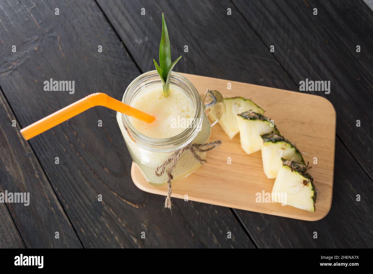 pineapple smoothie on wood background Stock Photo - Alamy