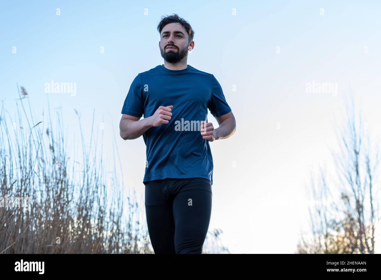 Young man jogging in foot hi-res stock photography and images - Alamy