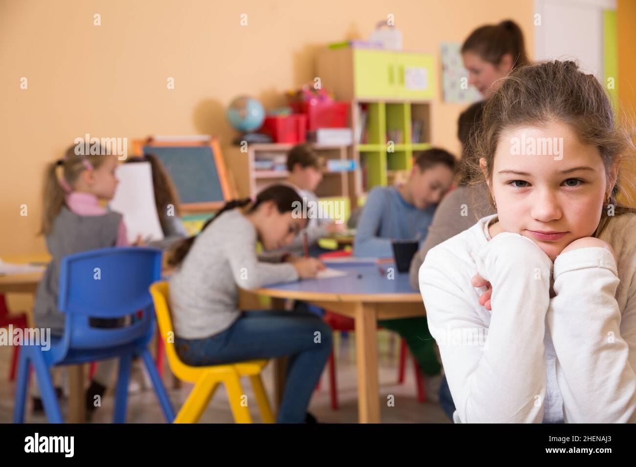 Portrait of sad unhappy schoolgirl and children Stock Photo - Alamy