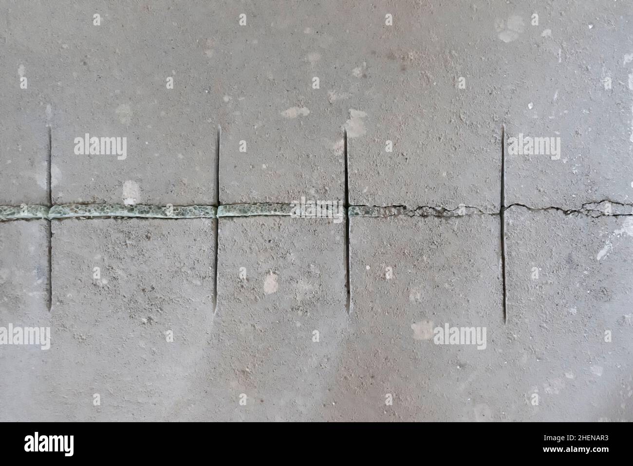 cut in the gray screed to avoid movement Stock Photo - Alamy