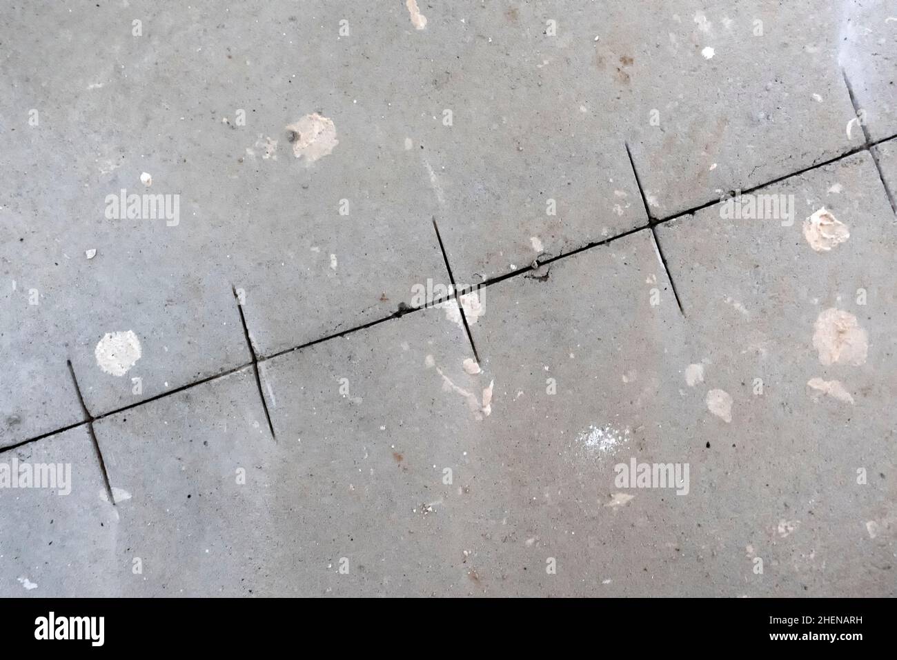cut in the gray screed to avoid movement Stock Photo - Alamy