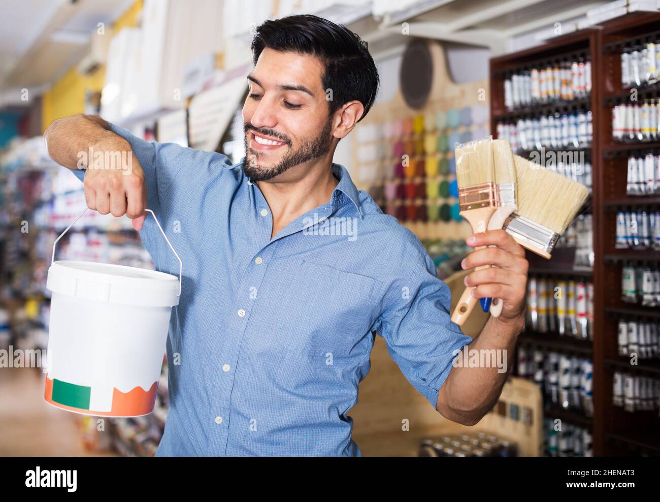 Male buyer in paint store Stock Photo - Alamy