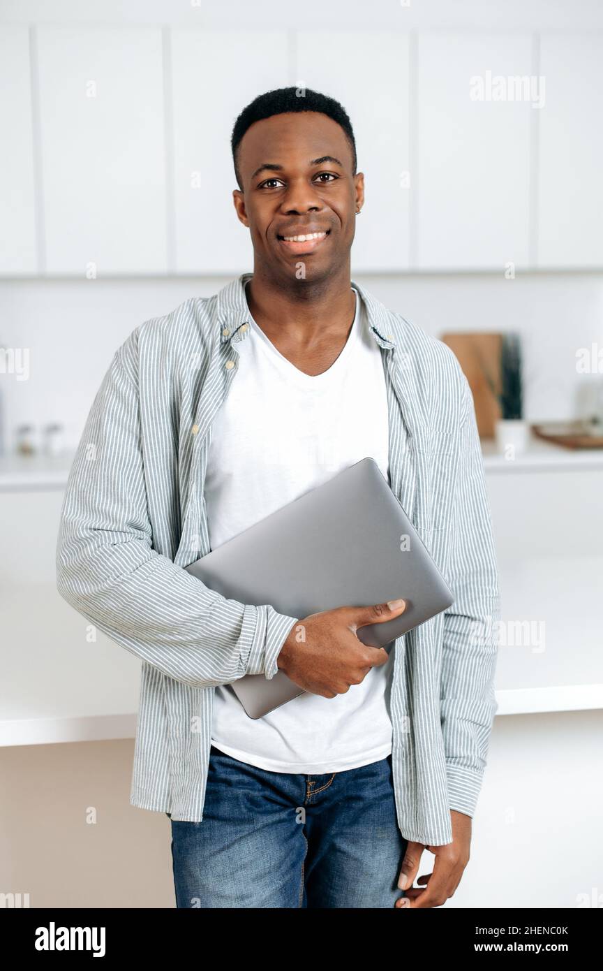 Stylish confident student holding laptop hi-res stock photography and ...