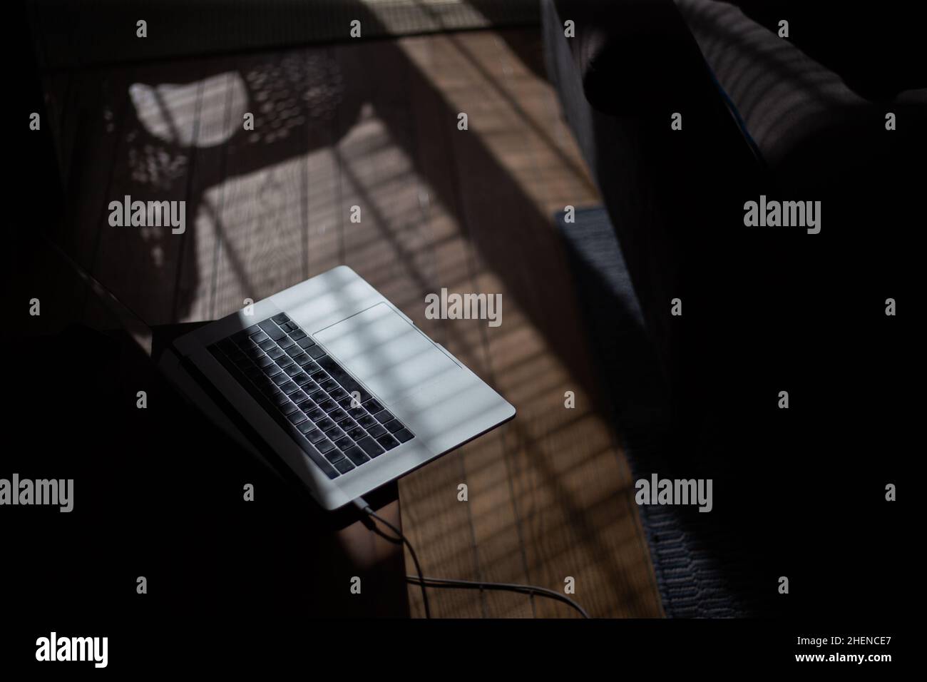 Laptop on the table in the interior of the apartment Stock Photo - Alamy
