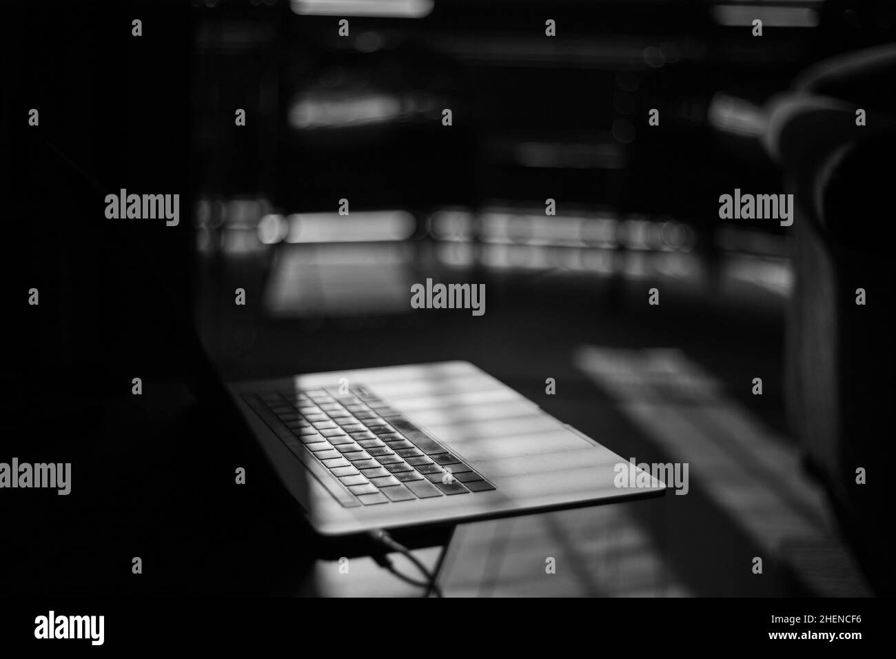 Laptop on the table in the interior of the apartment Stock Photo - Alamy