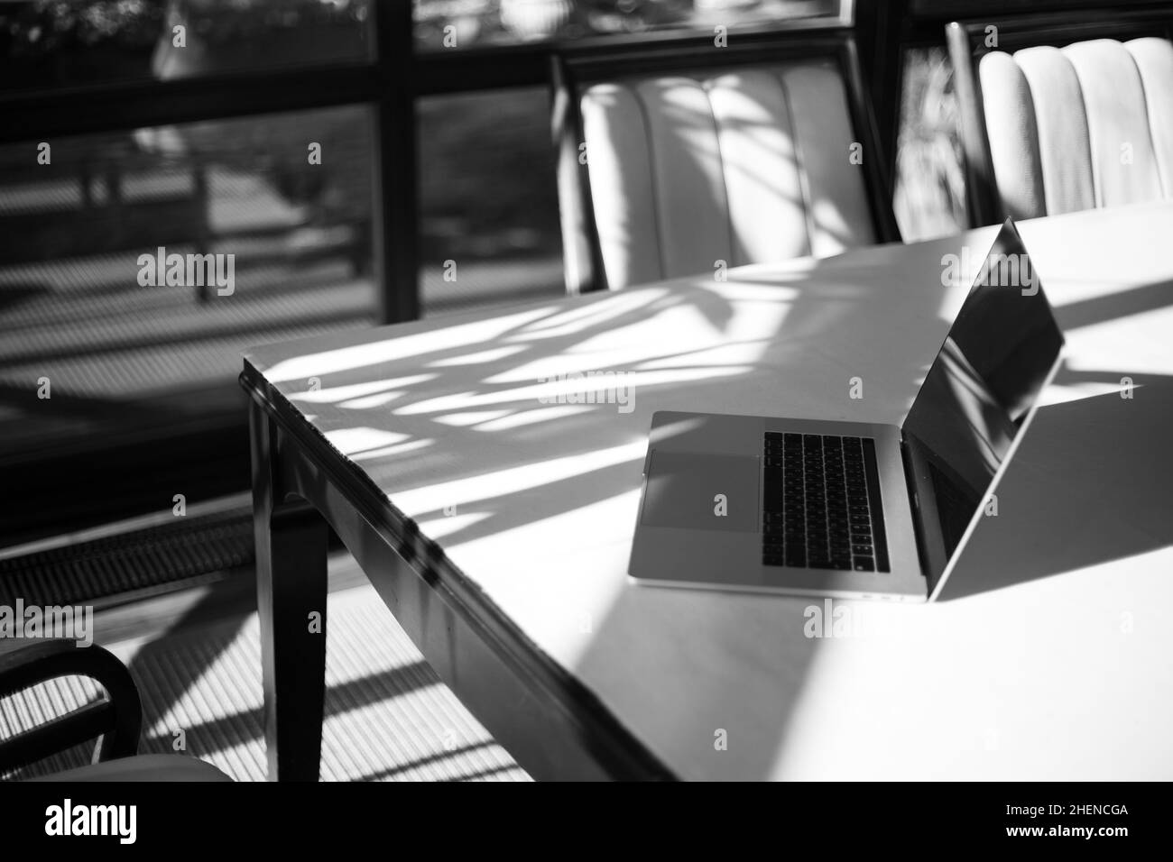 Laptop on the table in the interior of the apartment Stock Photo - Alamy