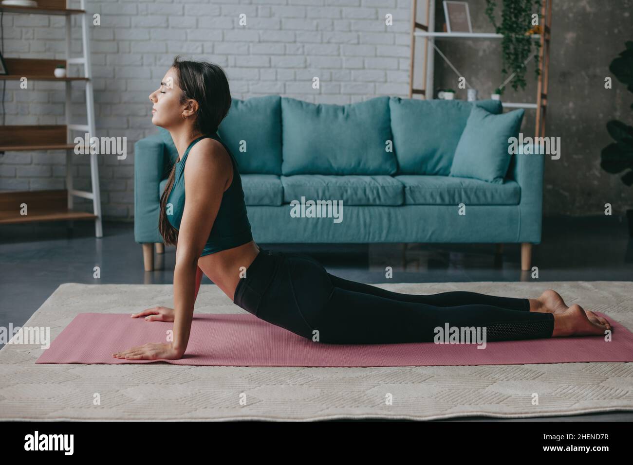 Caucasian fit woman streching at home. Yoga mat. Healthy lifestyle ...