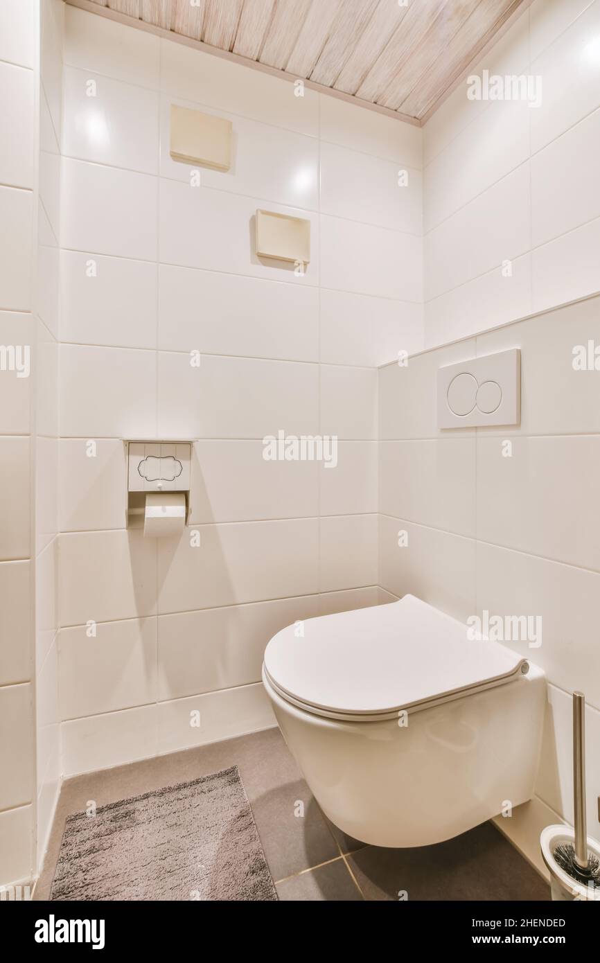 Interior of small clean restroom in miniature style Stock Photo - Alamy