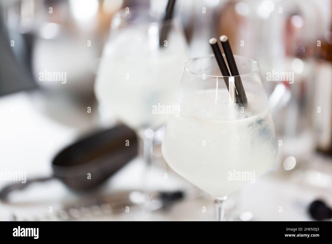 Cocktail glasses with alcohol drink on table Stock Photo - Alamy
