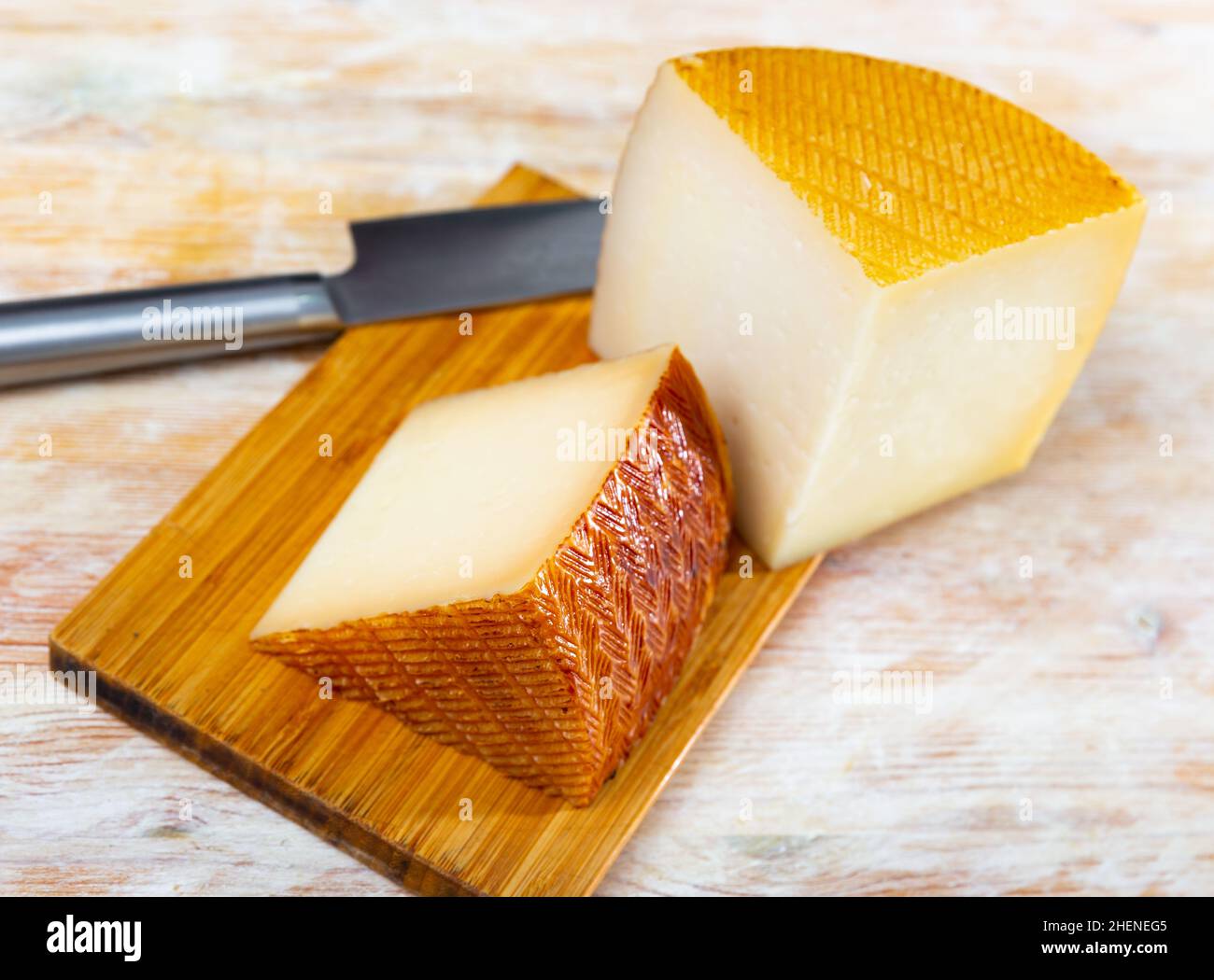 Traditional Spanish cheese - with ivory color and small irregular holes ...