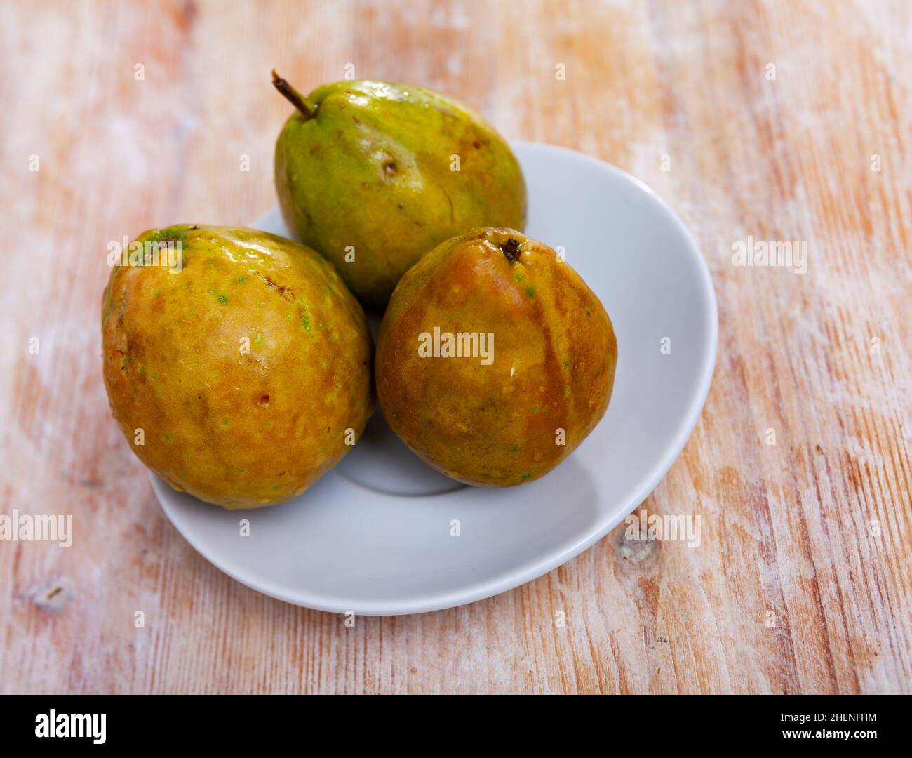 Fresh organic red guavas fruit cut in half on a wooden board. Exotic ...