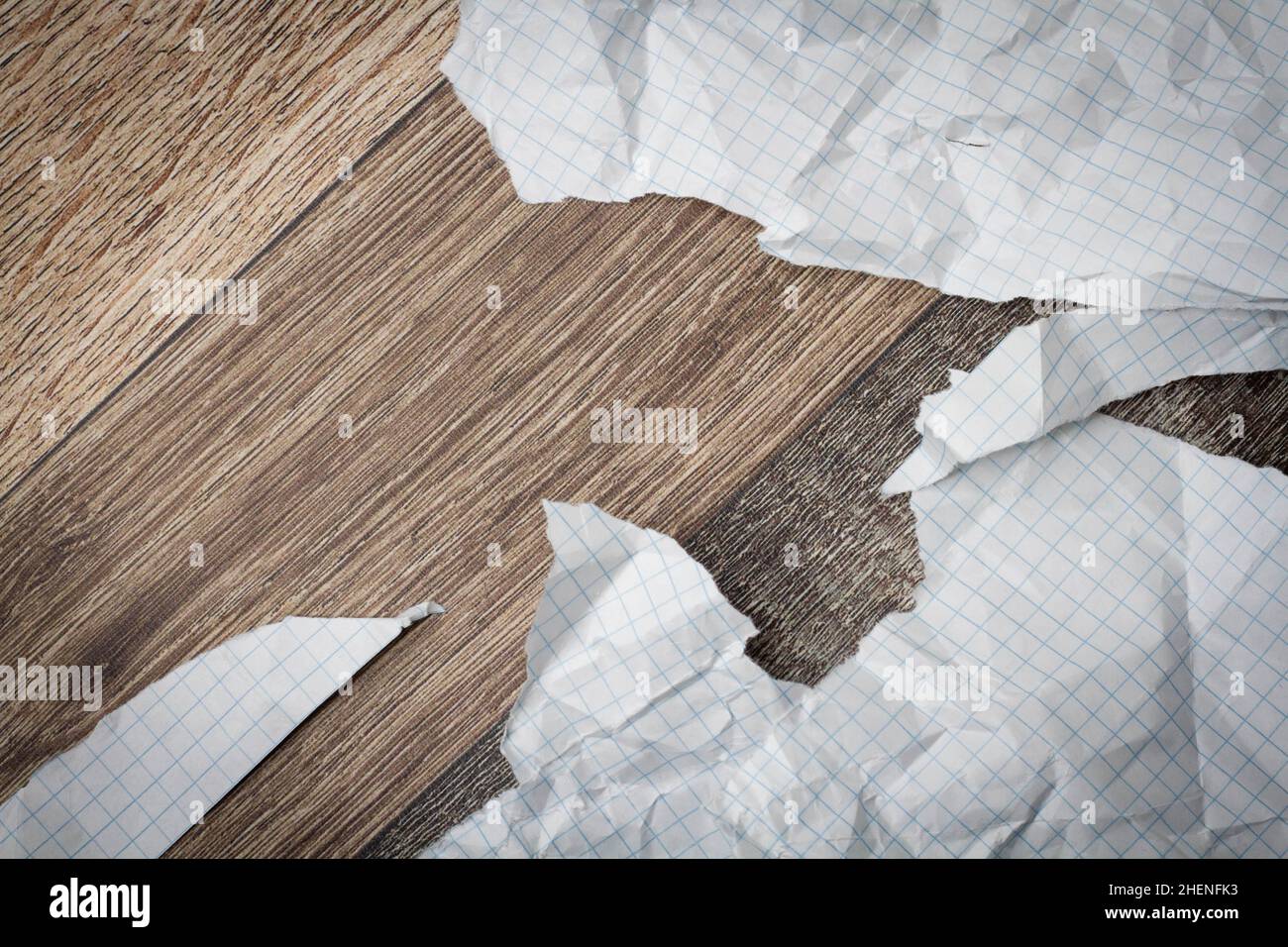 Crumpled and torn paper on the table. Notepad on crumpled paper ...