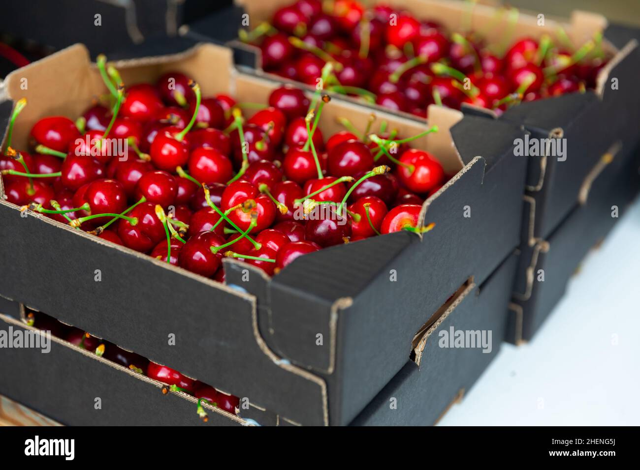 Fresh cherry on counter in supermarket Stock Photo - Alamy