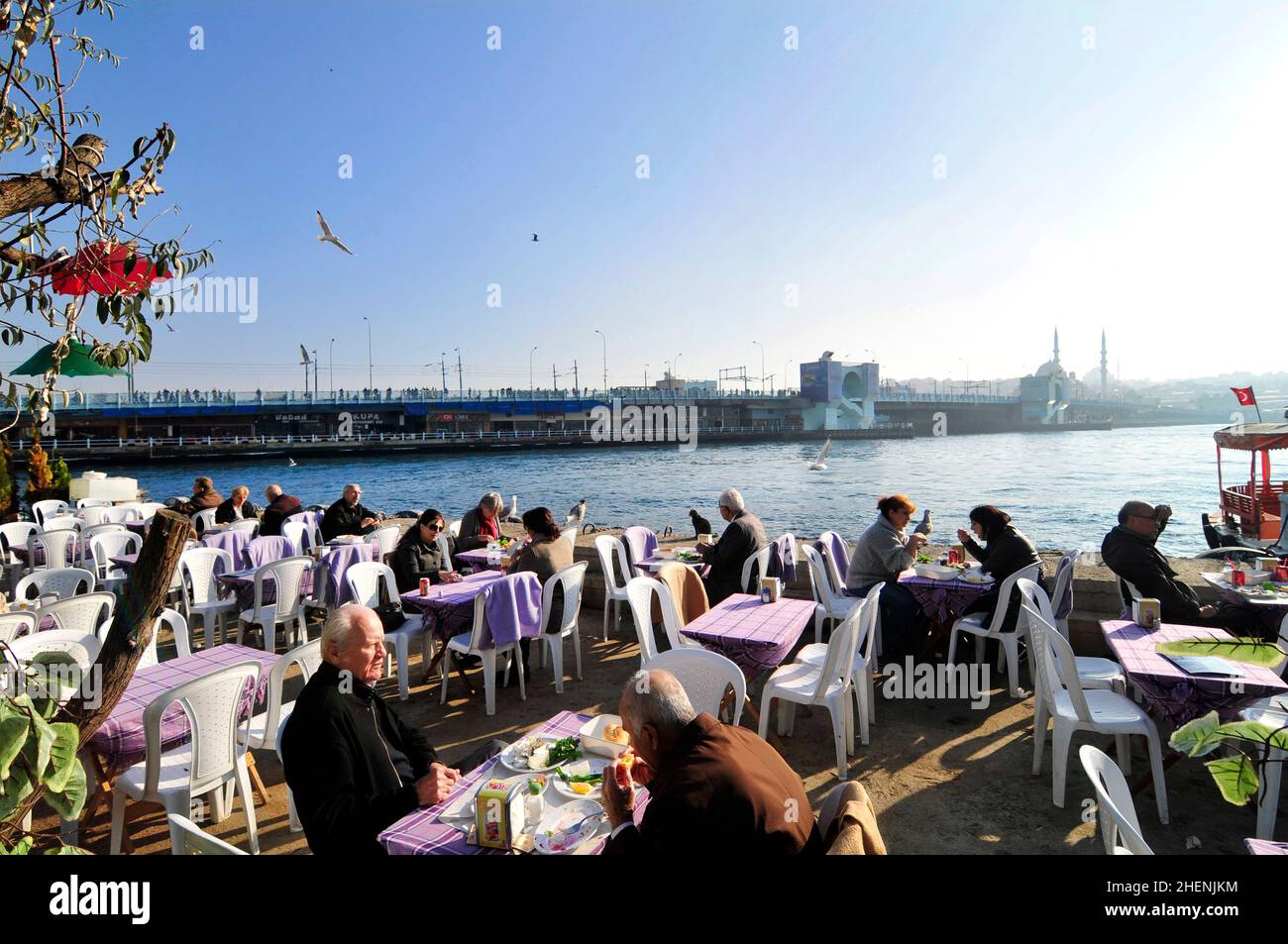 A waterfront restaurant serving seafood and fish sandwiches in Istanbul ...