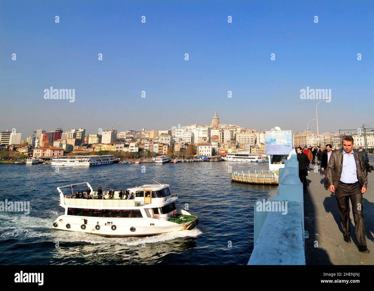 Walking on the Galata bridge over the Golden Horn in Istanbul, Turkey ...