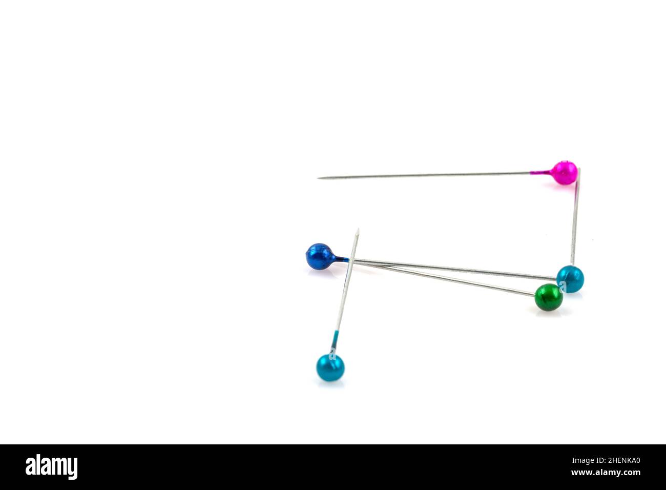 Color sewing push pins isolated on white background Stock Photo - Alamy