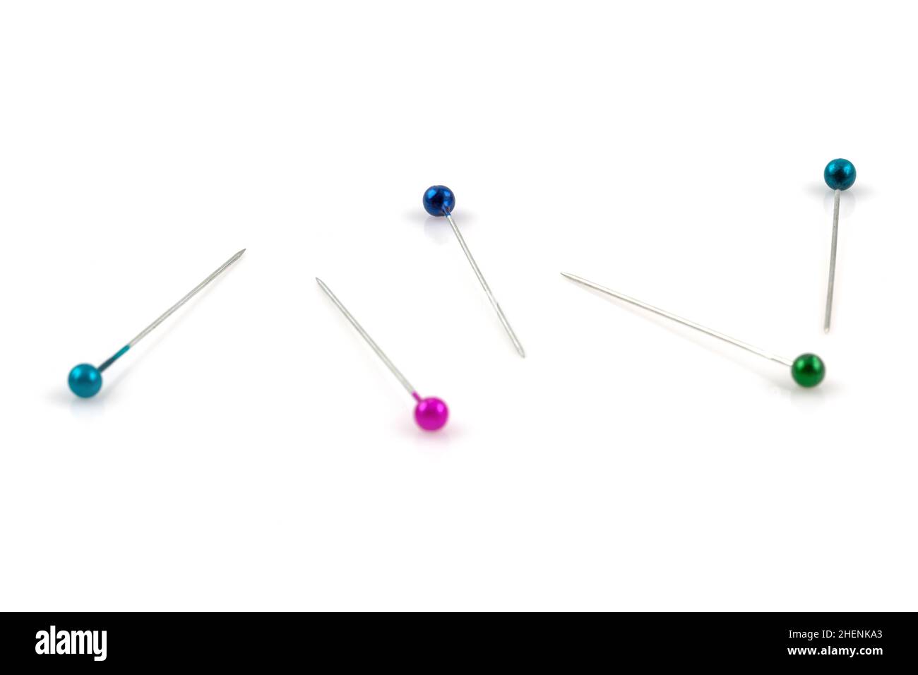 Color sewing push pins isolated on white background Stock Photo - Alamy