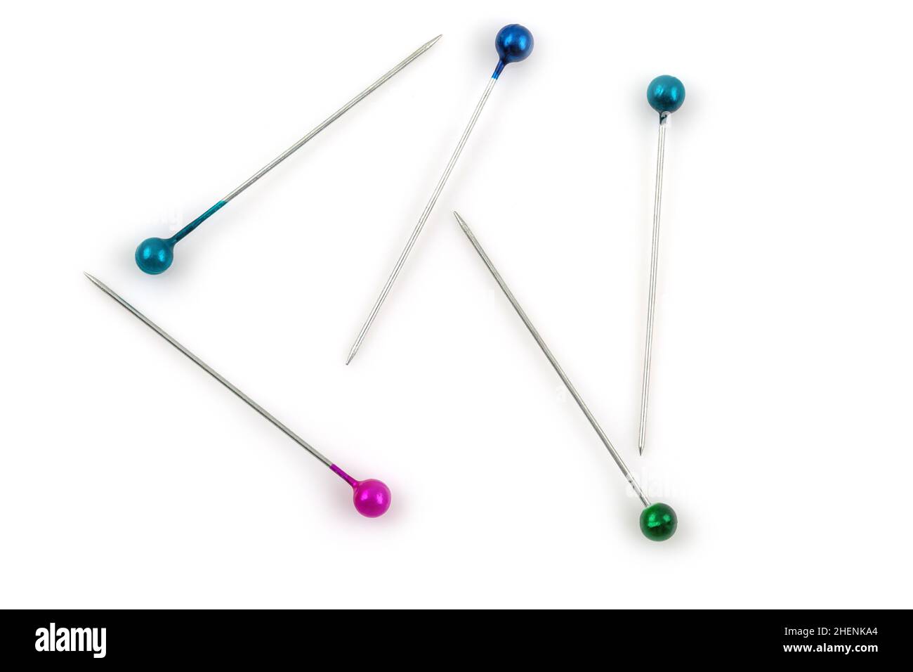 Color sewing push pins isolated on white background Stock Photo - Alamy