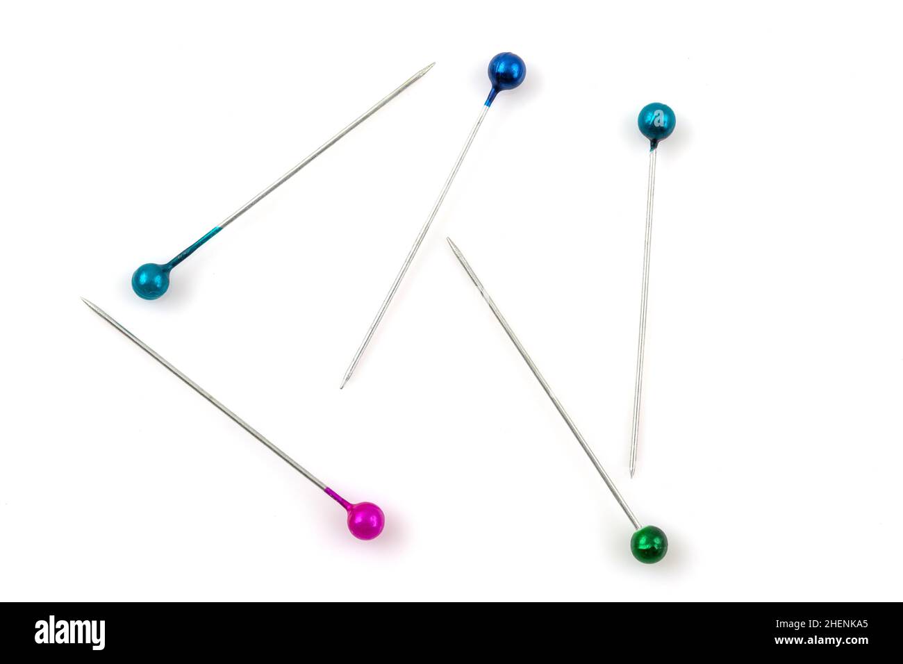 Color sewing push pins isolated on white background Stock Photo - Alamy