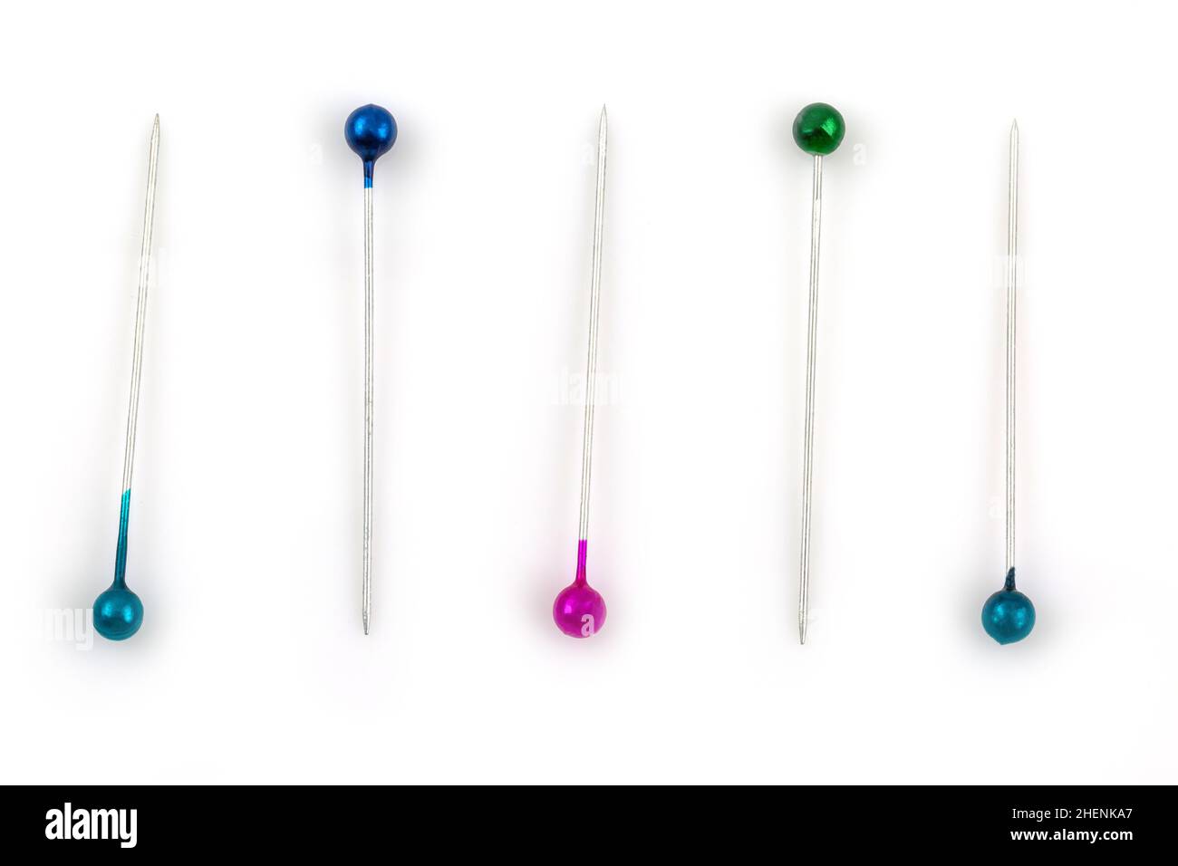 Color sewing push pins isolated on white background Stock Photo - Alamy