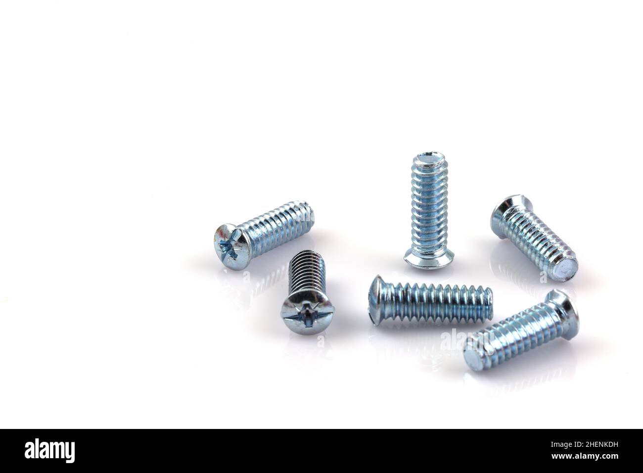 screwed screws nuts against isolated on white background Stock Photo ...