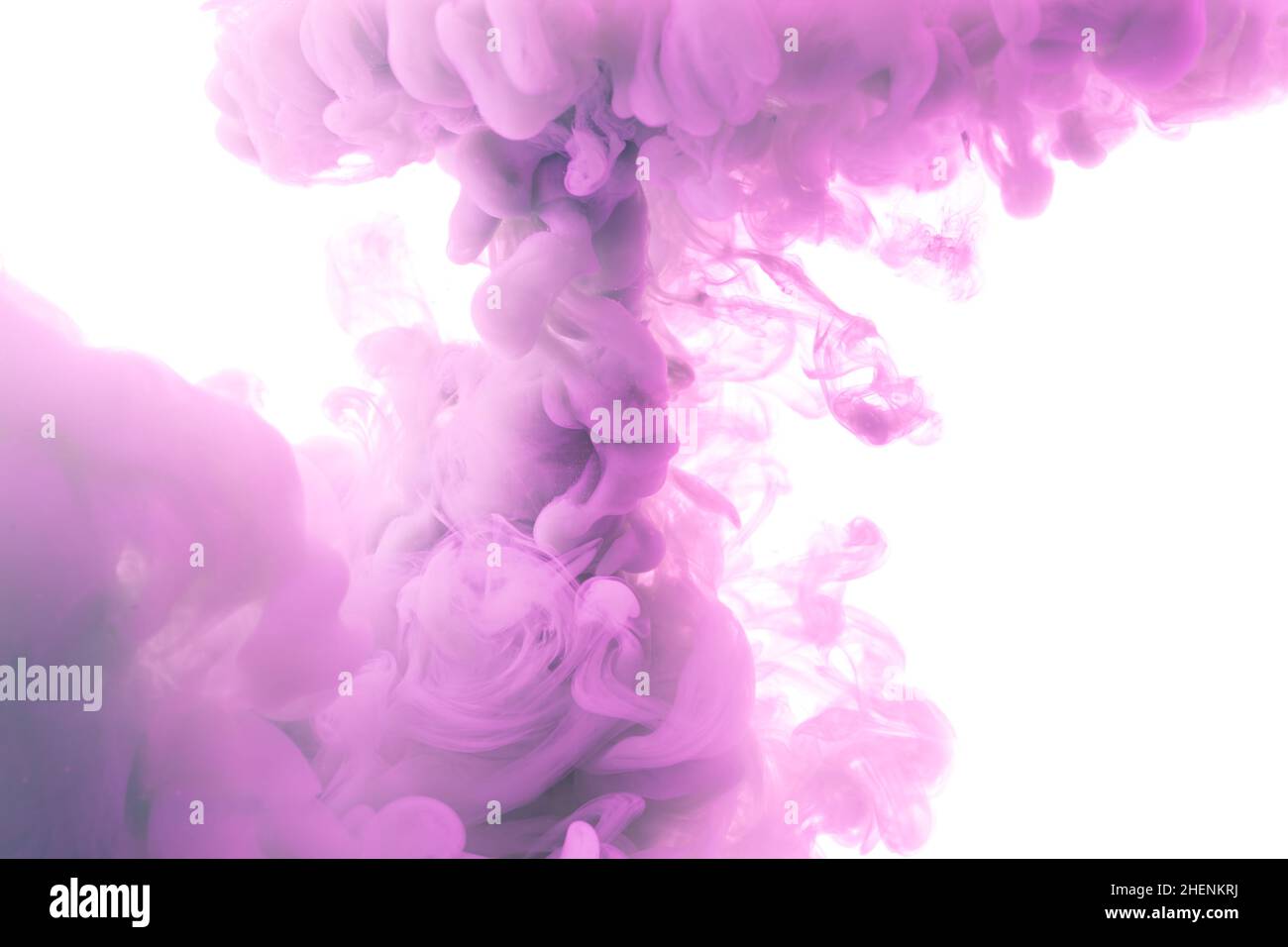 Vertical splash of purple paint in water against white background Stock ...