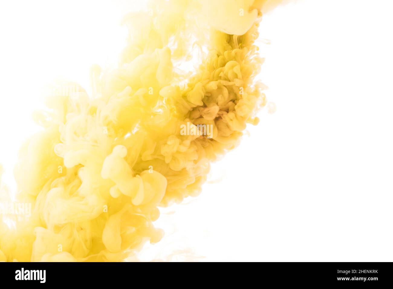 Diagonal splash of yellow paint in water against white background Stock ...