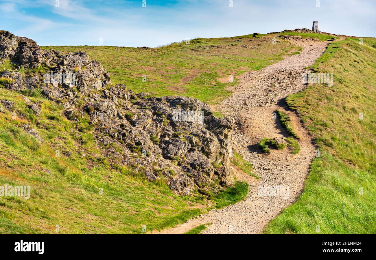 Steep gravel footpath,worn by many visitors.Early morning sunshine and ...