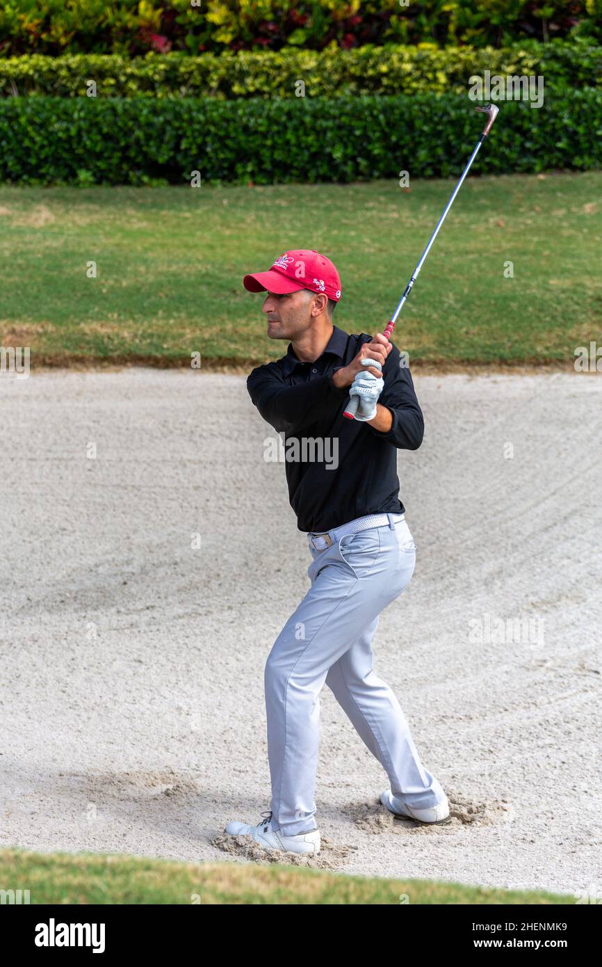 Golf player teeing off. Man hitting golf ball from tee box at Golf Club ...
