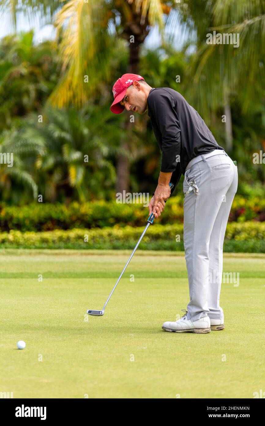 Golf player teeing off. Man hitting golf ball from tee box at Golf Club ...