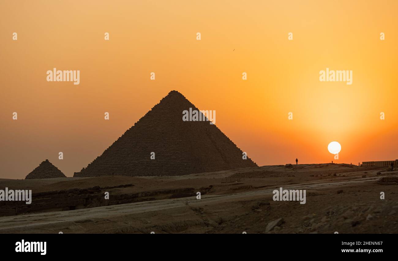 Stunning sunset behind the Great Pyramids of Giza, Egypt Stock Photo ...
