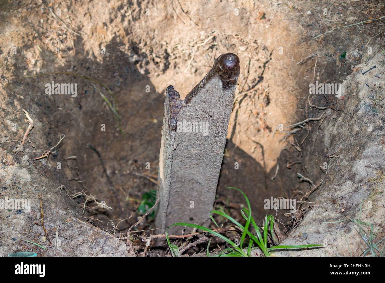 Iron rail buried in the ground, old geodetic datum point Stock Photo ...