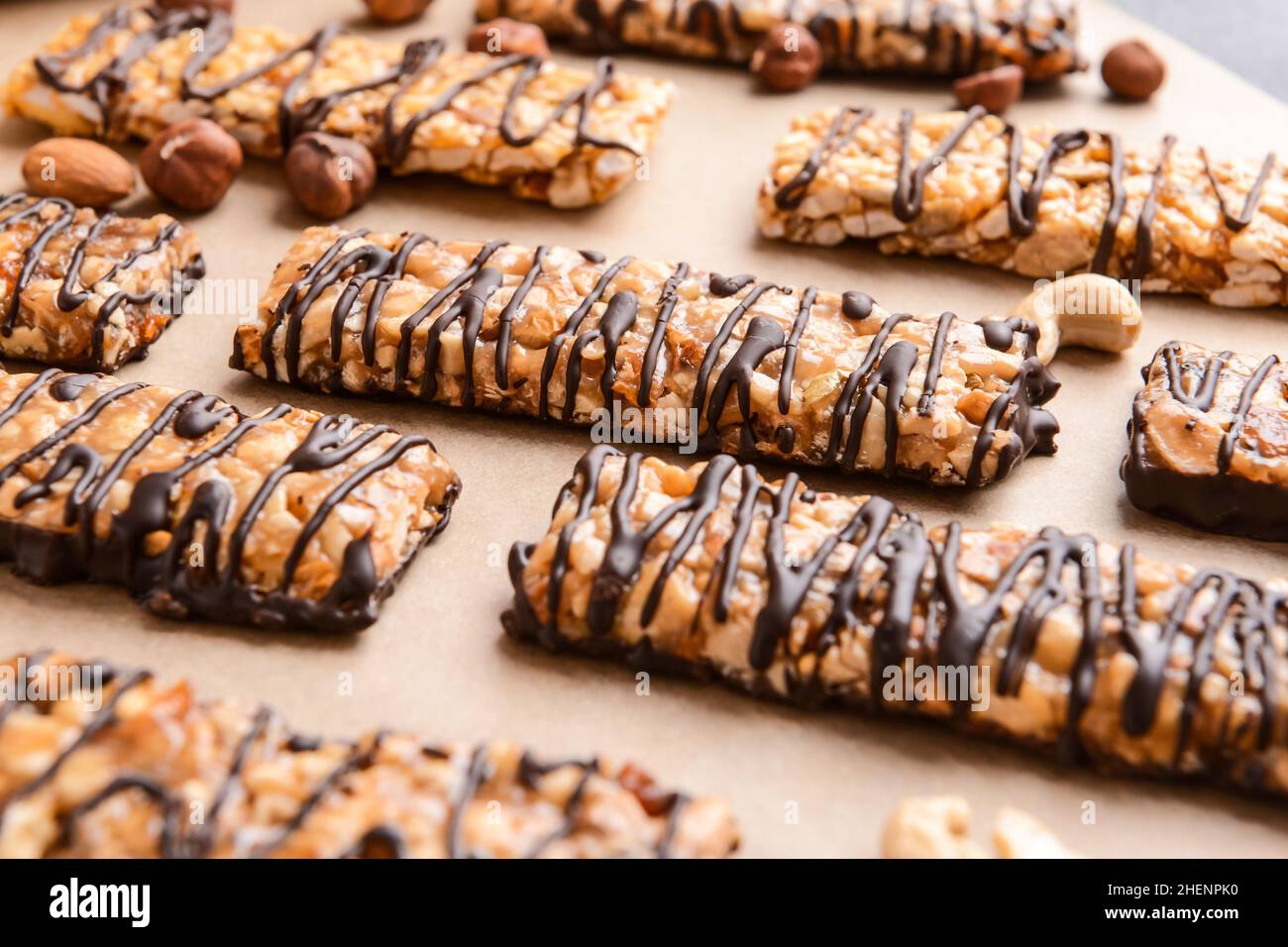 Tasty chocolate nut bars on parchment Stock Photo - Alamy